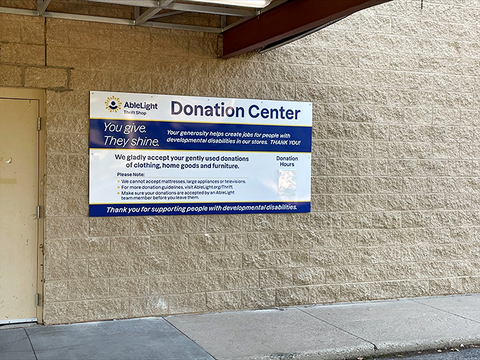 The donation center's sign explains AbleLight's mission with heartwarming clarity: your gently-used donations create opportunities for people with developmental disabilities.