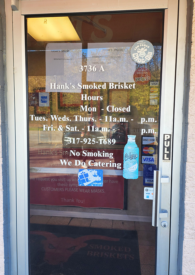 The door that lists the hours – crucial information for planning your week around barbecue availability, as any sensible person would.