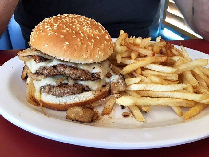 Double the cheese, double the satisfaction in this towering tribute to American diner burger craftsmanship and indulgence.
