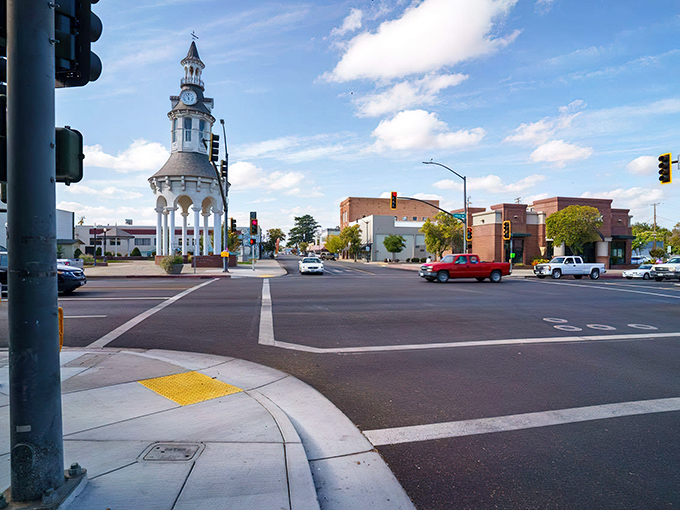 The intersection of past and present, where Red Bluff's historic clock tower watches over modern traffic with dignified patience.