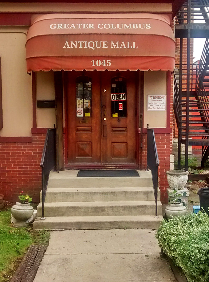 The entrance to wonderland isn't down a rabbit hole&mdash;it's through these wooden doors beneath a salmon-colored awning in Columbus.