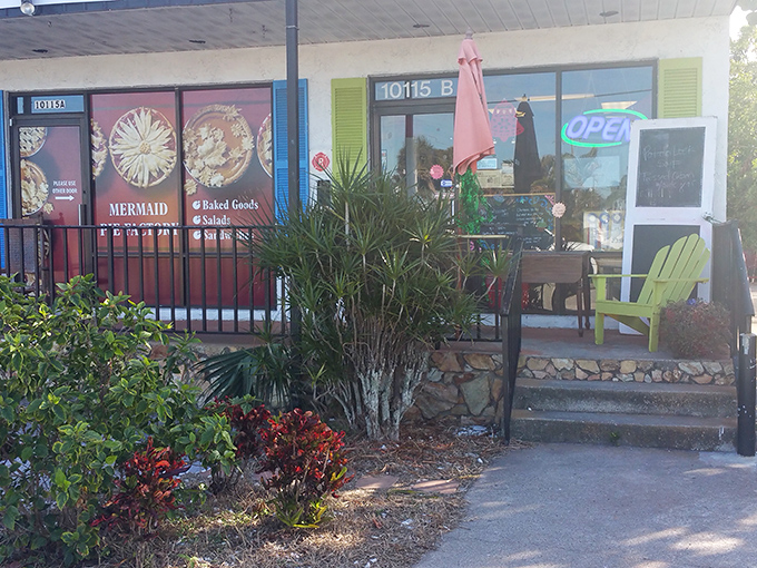 The entrance, complete with cheerful green chair and tropical plants, feels like the gateway to a friend's porch rather than a business.