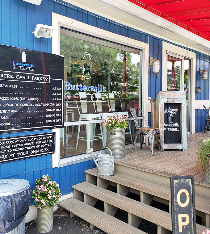 The entrance says it all: blue clapboard, metal chairs, and helpful parking instructions&mdash;because nothing should stand between you and great breakfast.