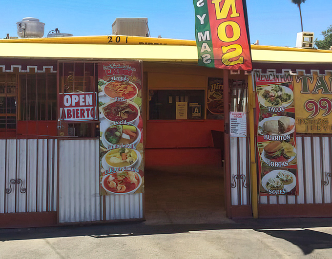 The entrance beckons with promises of authentic Mexican delights. Those 99&cent; taco signs aren't just advertisements&mdash;they're invitations to affordability.