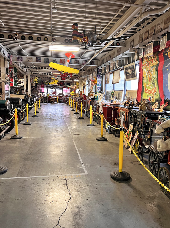 The yellow-roped path beckons visitors deeper into the collection, where vinyl records line the walls like portals to musical memories past.