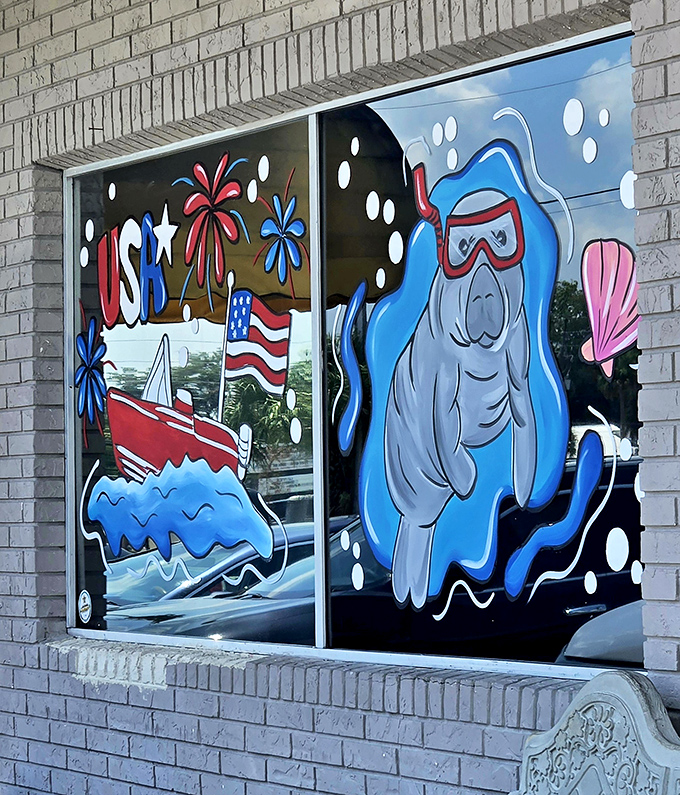 Window art celebrating Crystal River's famous manatees – because even sea cows know good cooking when they smell it.