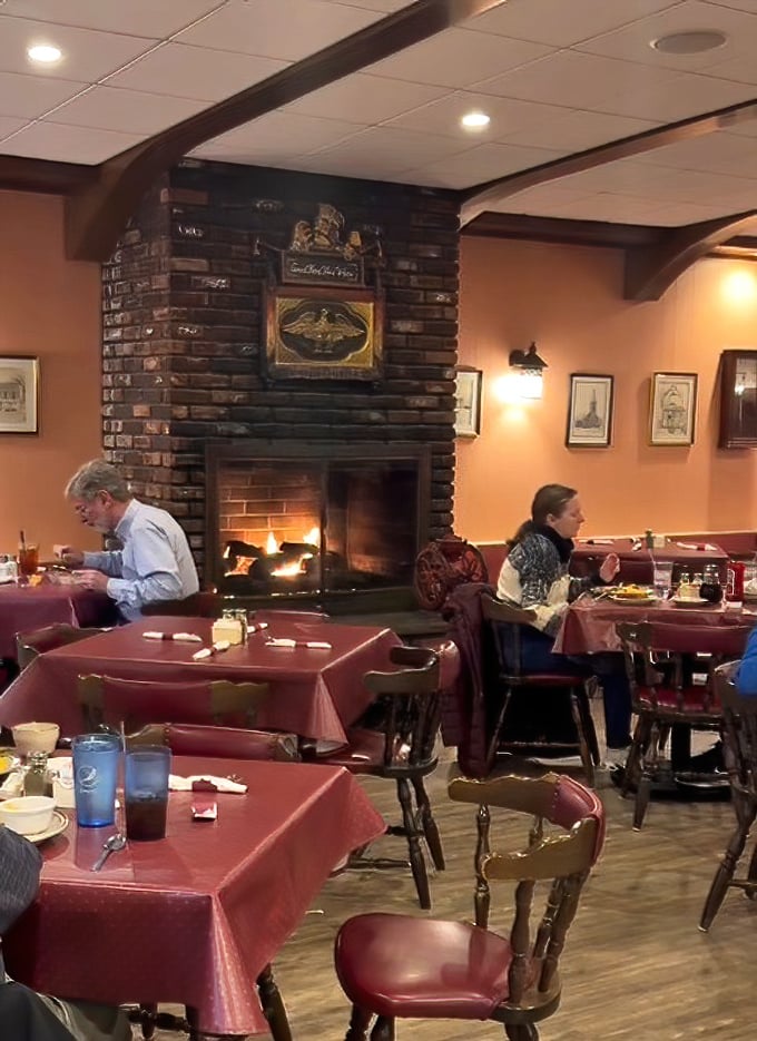 The brick fireplace creates a hearth-and-home feeling that makes winter mornings bearable and pancake enjoyment mandatory.