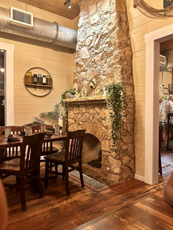 That stone fireplace has probably witnessed more marriage proposals than a jewelry store. Cozy dining at its unpretentious best.