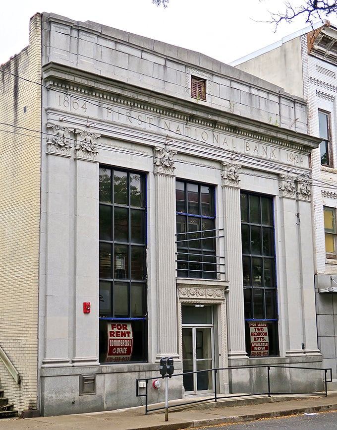 The First National Bank building's classical details remain impressive even in retirement, like a former ballroom dancer who still maintains perfect posture.