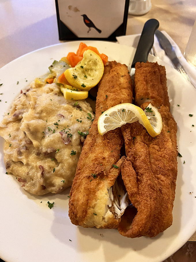 Fish so fresh it practically introduces itself. Golden-fried fillets with creamy mashed potatoes and colorful vegetables make a plate worth photographing.