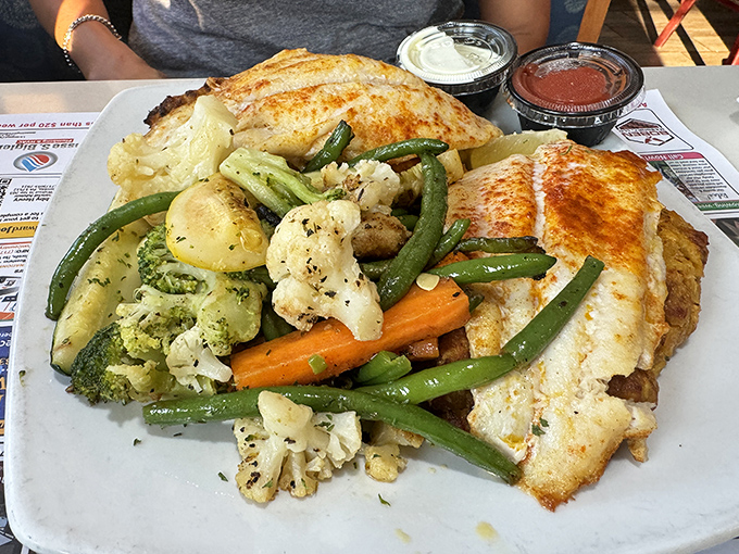 
Fish so perfectly cooked it flakes at the mere suggestion of your fork, surrounded by vegetables that didn't sacrifice their dignity in the cooking process.