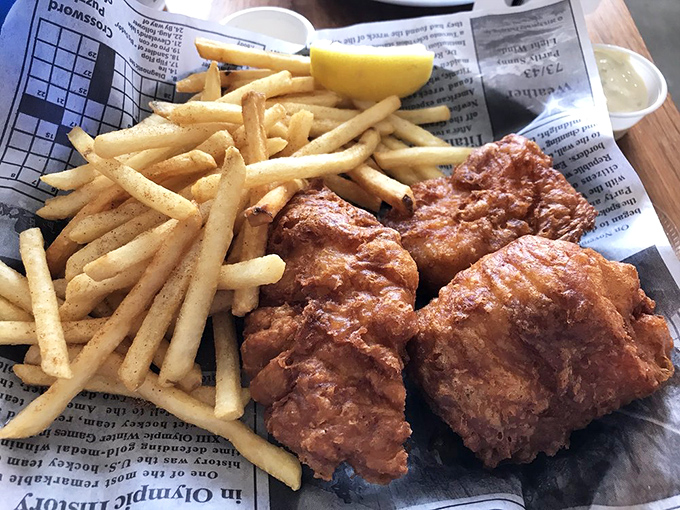 Fish and chips done right &ndash; crispy golden batter protecting flaky white fish, with fries standing by for the inevitable "just one more bite" syndrome.