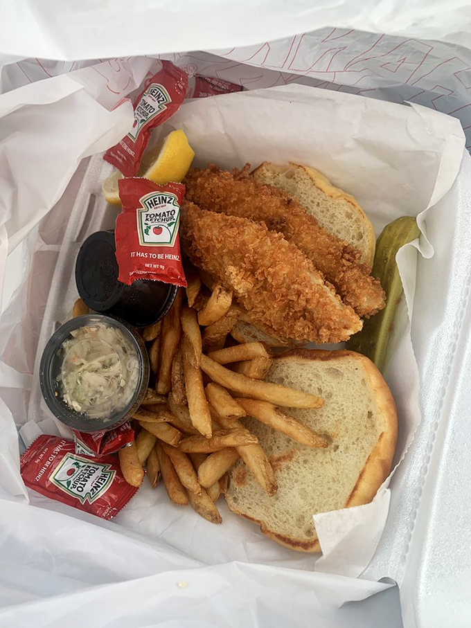 The fish sandwich basket&mdash;complete with the universal signal of quality: a pickle spear standing at attention.
