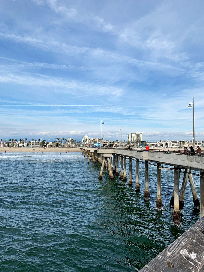The Venice Pier stretches toward the horizon like a runway for dreams, offering Pacific panoramas and fishing opportunities.