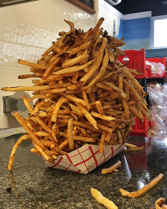 The French fry tower of power&mdash;crispy, golden, and stacked higher than your weekend to-do list. Worth every carb-laden bite.