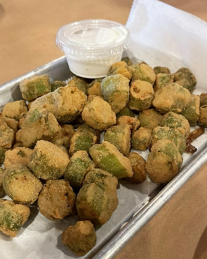 Fried okra that solves the eternal southern vegetable dilemma&mdash;crispy, golden exterior giving way to tender green goodness inside. Dipping sauce non-negotiable.