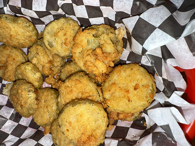 Fried pickles that achieve the impossible: maintaining their crunch while delivering that perfect vinegary tang. A masterclass in simple pleasures.