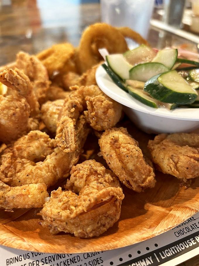 These golden-fried shrimp aren't just food&mdash;they're little nuggets of ocean sweetness wrapped in a crunchy hug. The cucumber salad provides moral support.