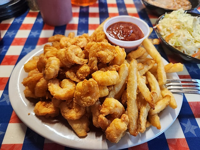 Fried shrimp and fries that would make any coastal seafood shack jealous. The golden ratio of crispy coating to succulent seafood is mathematical perfection.