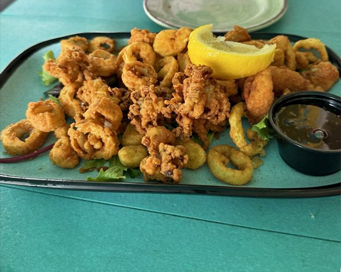 Fried calamari that actually tastes like calamari, not just fried batter. The perfect golden rings are like edible jewelry from the sea.