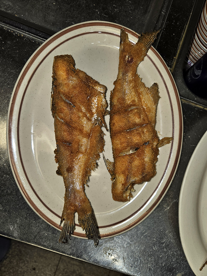 Fried fish so perfectly golden, it makes you wonder if the cook has some secret pact with the breading gods.