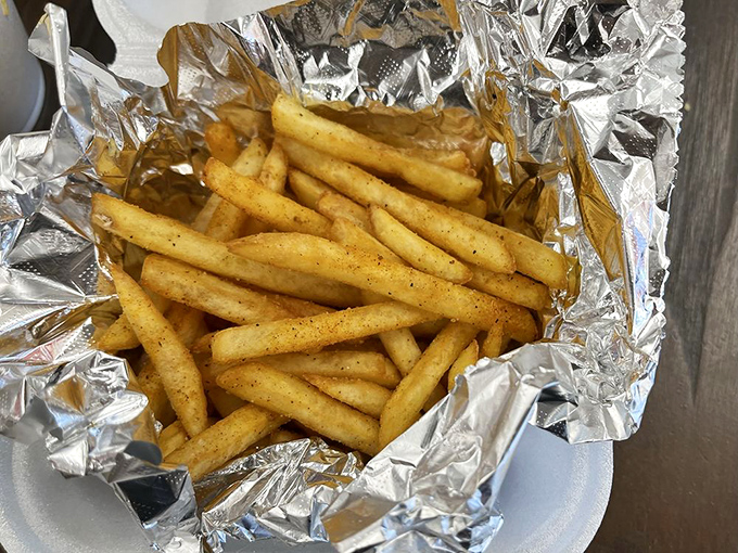 Fries dusted with secret spices, wrapped in foil like the simple yet perfect gift they are to your taste buds.