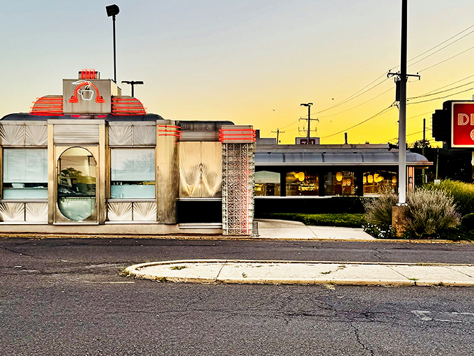 As twilight settles, The Dining Car's windows glow with promise&mdash;a landmark that's witnessed first dates, family celebrations, and everyday hunger for decades.