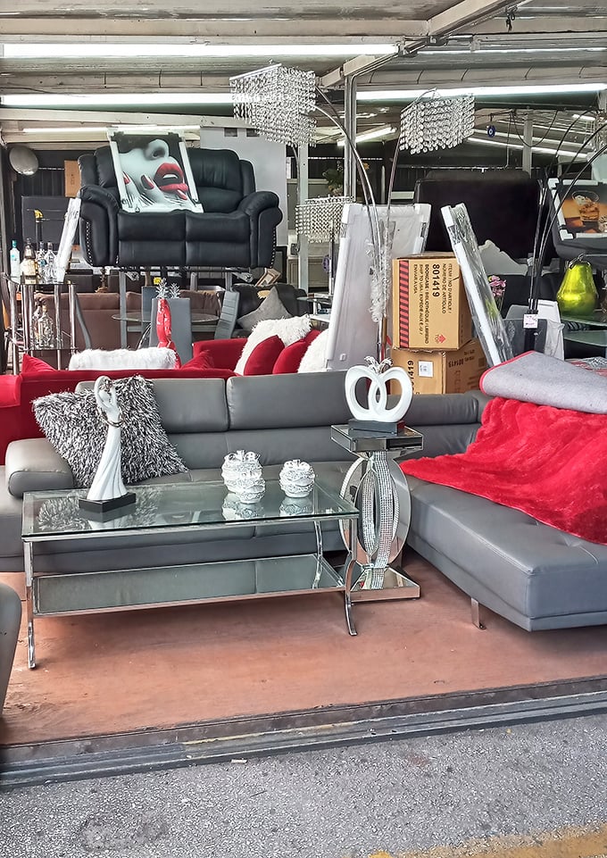 Living room displays that scream "Miami chic" with crystal chandeliers hanging over leather recliners. Subtle? No. Conversation-starting? Absolutely.