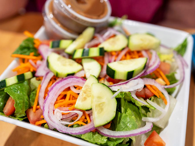 This garden salad brings crisp, colorful relief to a menu that doesn't shy away from indulgence. Those purple onions add just the right bite.