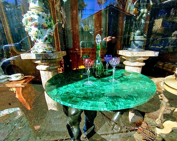 That malachite table isn't just furniture – it's functional art that would make even the most modest coffee cup feel like it's being served at Versailles.