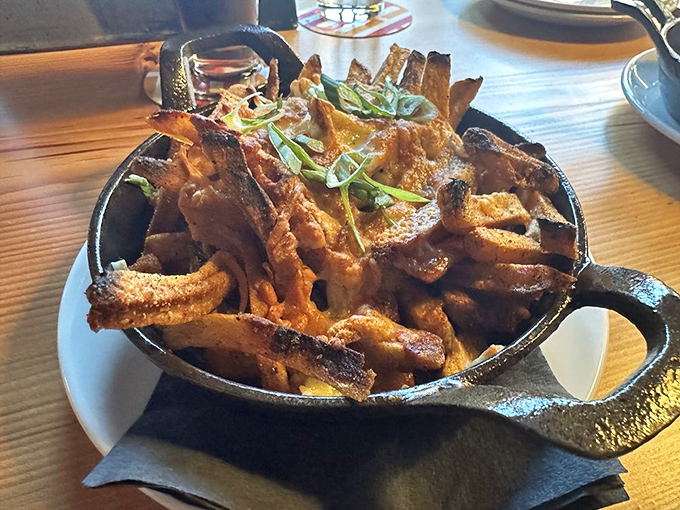 These aren't just fries&mdash;they're a declaration of potato love, crispy on the outside, fluffy inside, and baptized in savory gravy with a sprinkle of green onions.