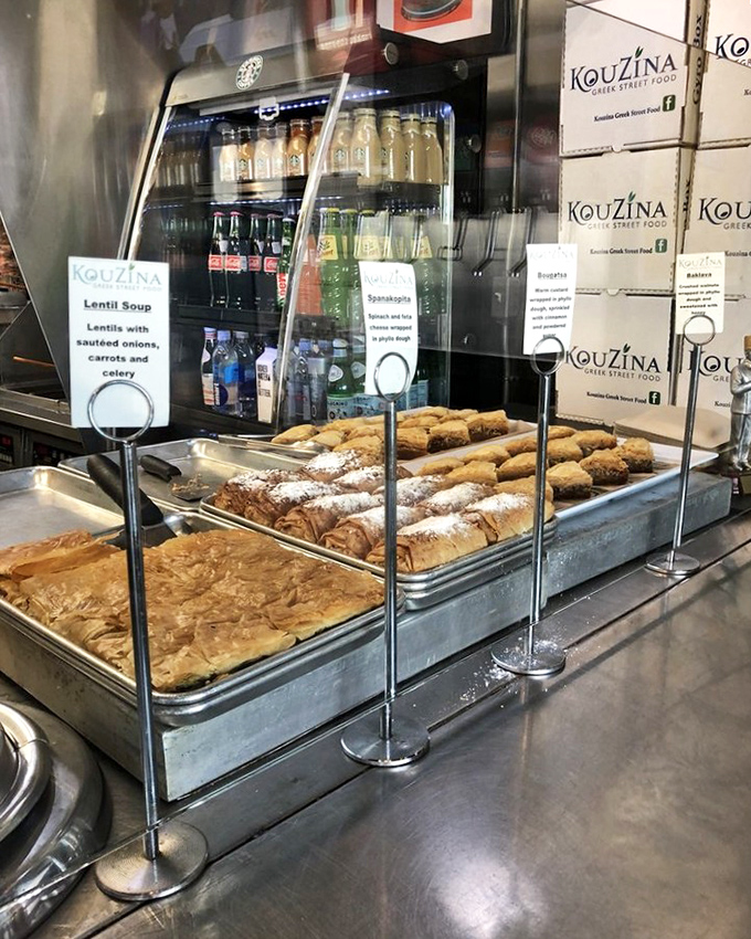 Phyllo-wrapped treasures lined up like soldiers of sweetness, ready to deploy their honey-soaked mission directly to your pleasure centers.