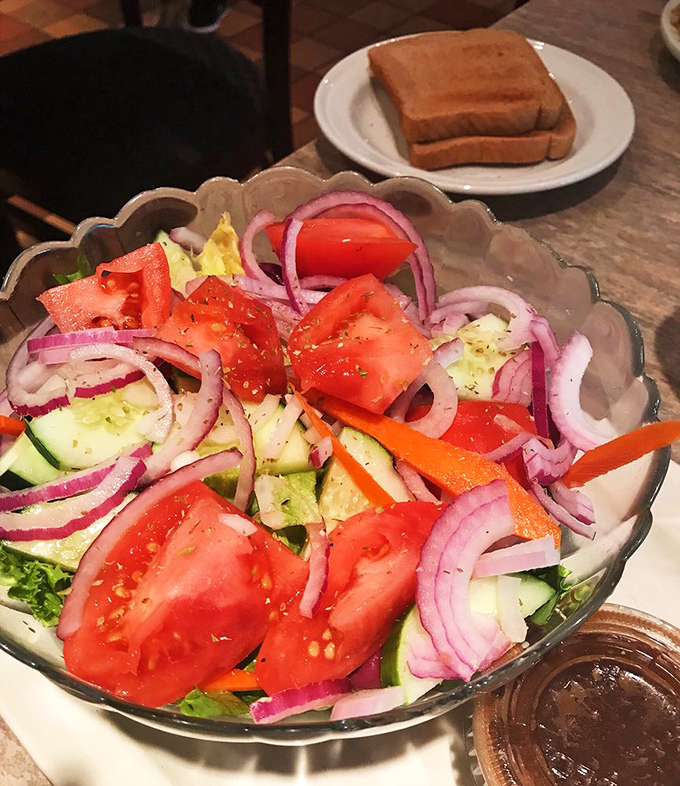 A Greek salad so fresh it practically speaks with an accent. Those vibrant vegetables and purple onions are having the kind of colorful party your taste buds want to attend. 
