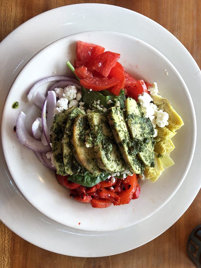This pesto chicken salad isn't just lunch&mdash;it's a Mediterranean vacation for your taste buds, no passport required.