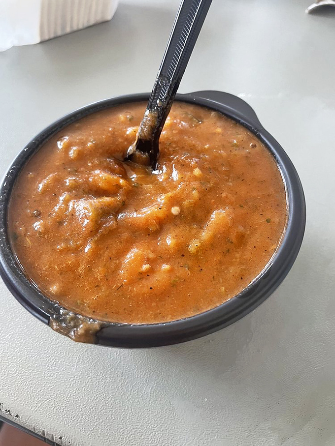 A bowl of rich, russet-colored gumbo that looks like it contains all the secrets of Gulf Coast cooking in one spoonful.