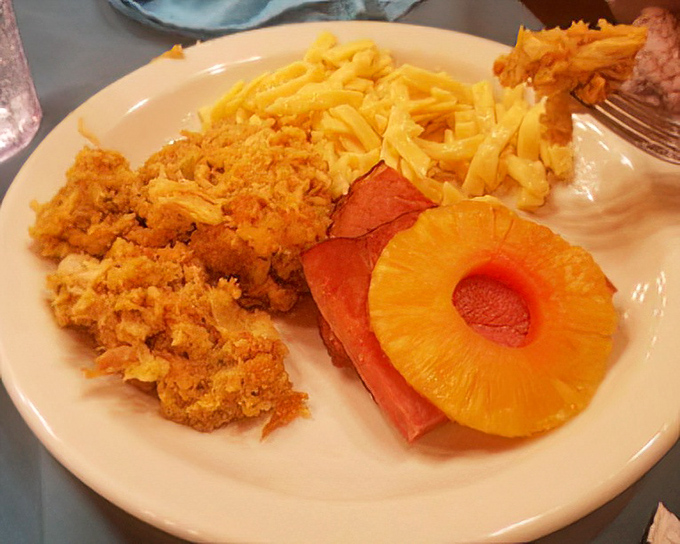 Ham with pineapple rings and mac and cheese&mdash;a plate that screams "Midwestern potluck champion" in the most delicious way possible.