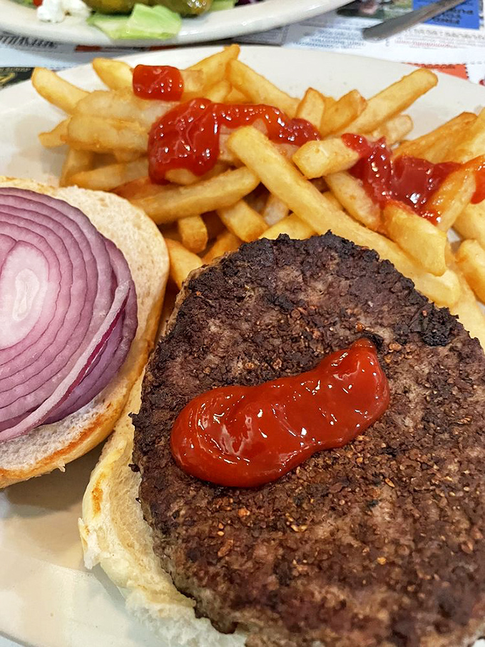 A burger so perfectly constructed it deserves its own architectural award and immediate consumption.