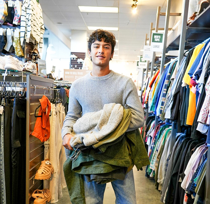 Arms full of finds and a smile that says, "Wait until you hear how little I paid for all this!" The universal expression of a successful shopping adventure.