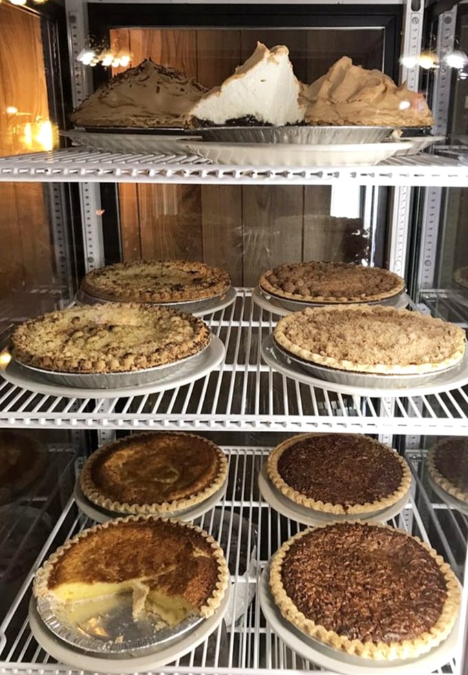 The pie case&mdash;where all diet resolutions go to die a delicious death. That mile-high meringue isn't just a topping&mdash;it's a fluffy cloud of sweet dreams.