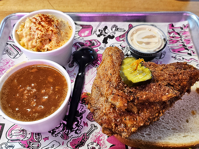 Hot chicken, beans, and mac and cheese: the holy trinity of Southern comfort that makes you want to hug the chef and take a nap.