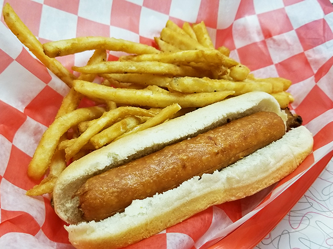 The hot dog&mdash;America's humble handheld masterpiece&mdash;elevated to art form with a soft bun, snappy dog, and fries that could make a Frenchman jealous.