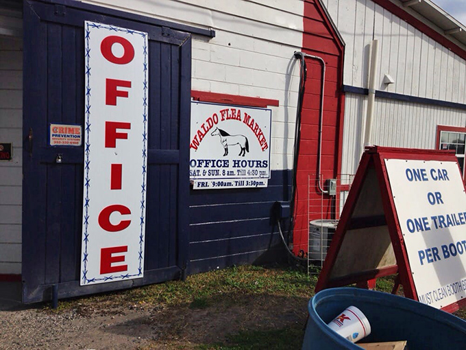 The office hours sign stands guard, a reminder that even treasure hunting has its schedule in the orderly chaos of Waldo.