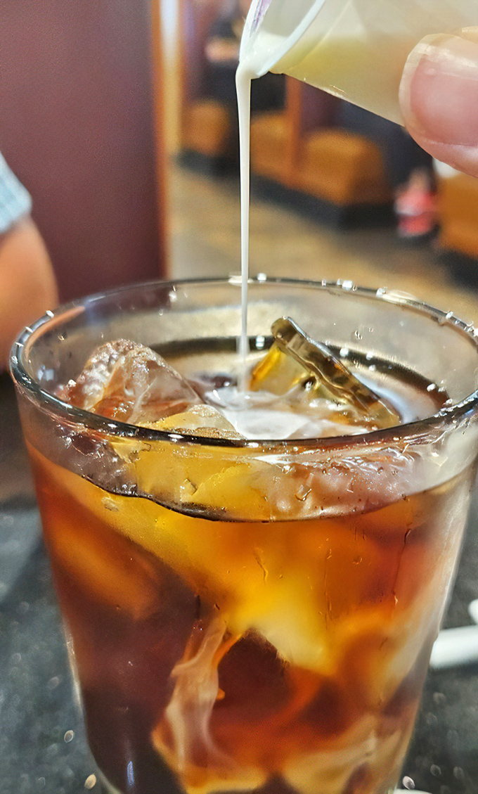 Iced coffee perfection with cream swirls that look almost too pretty to drink, but taste divine.