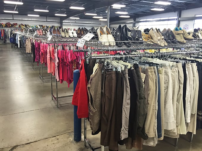 Color-coded clothing arranged with surprising precision. Pink transitions to red like a sartorial sunset, each hue offering different fashion horizons to explore.