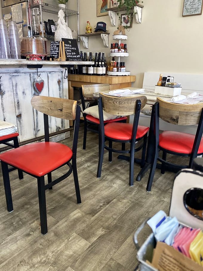 Rustic-chic interiors with thoughtful details. Red seat cushions add warmth to wooden chairs where breakfast memories are made one bite at a time.