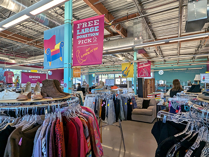 Colorful banners guide shoppers through departments while reminding everyone that this retail adventure supports healthcare services with every purchase.