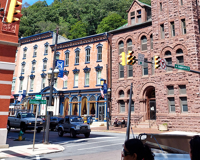 Historic buildings in contrasting colors create a streetscape that feels more European than Pennsylvanian, though the pickup trucks keep things grounded.