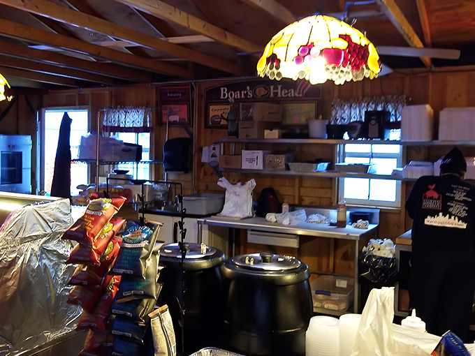 Stained glass lamps cast a warm glow over the rustic interior, creating the perfect atmosphere for serious meat consumption.