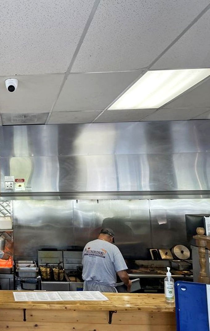 Behind the scenes, where burgers become legends. No molecular gastronomy here&mdash;just time-honored techniques and a well-seasoned grill.