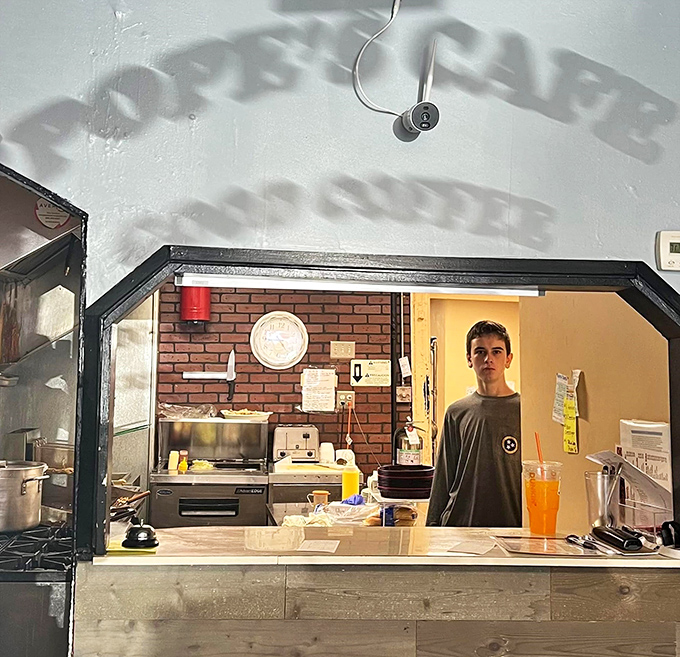 The pass-through window where culinary magic materializes&mdash;simple ingredients transformed into the comfort food that keeps locals coming back for decades. 